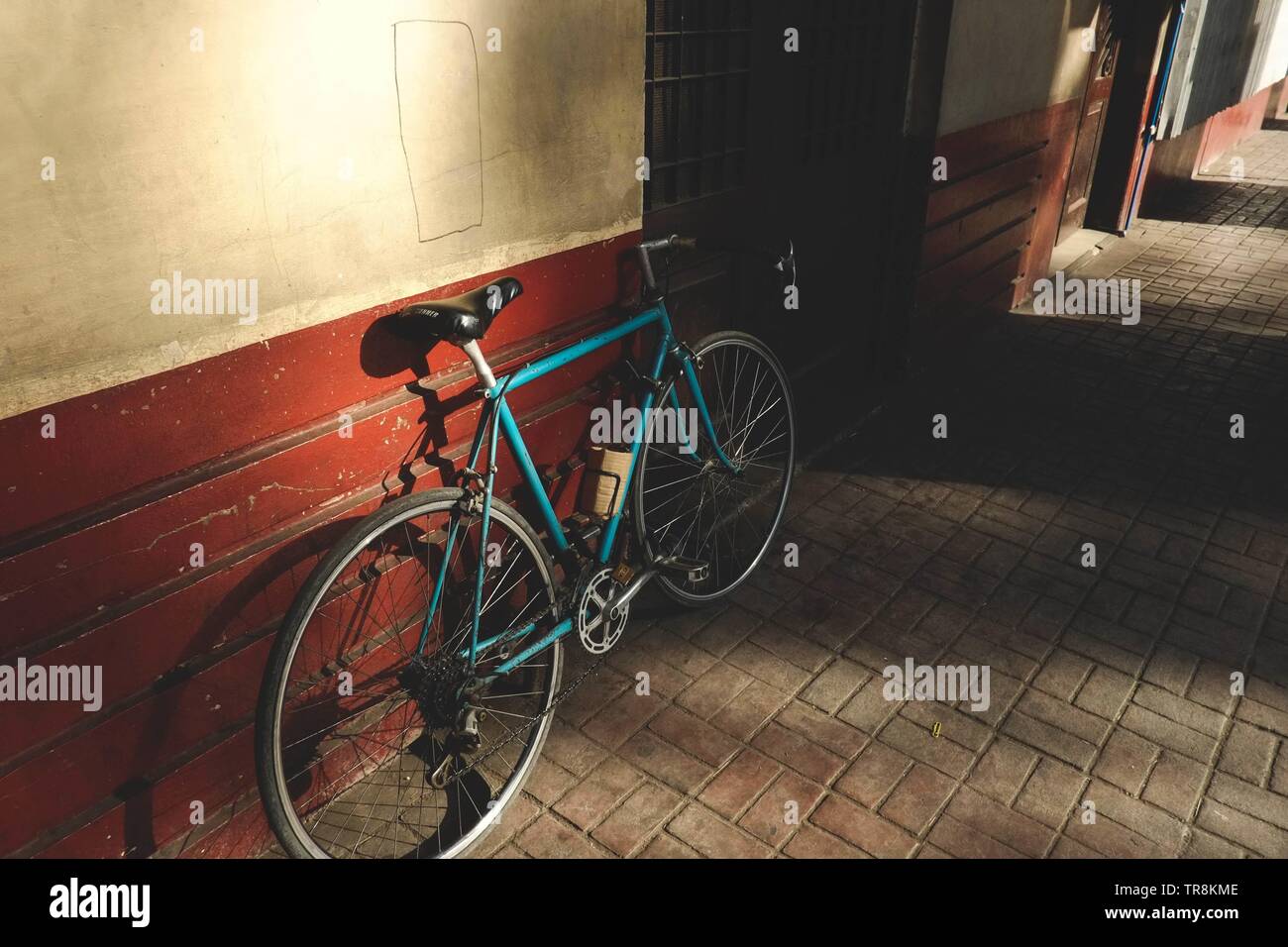Bicycle parked on the side Stock Photo - Alamy