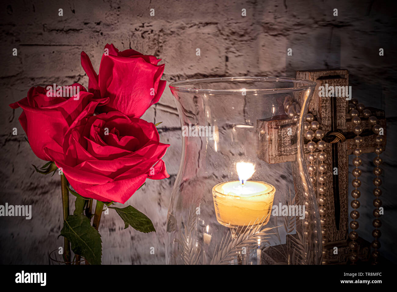 Rose with Candle, Cross and Pearls Stock Photo - Alamy