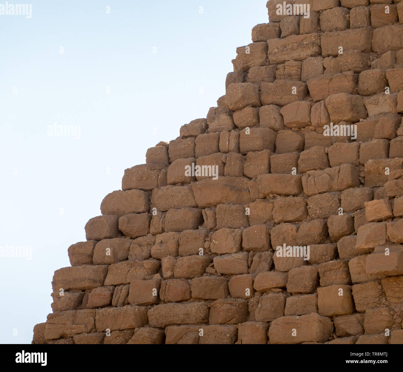 Close-up view of a pyramid made of roughly hewn sandstones and ...