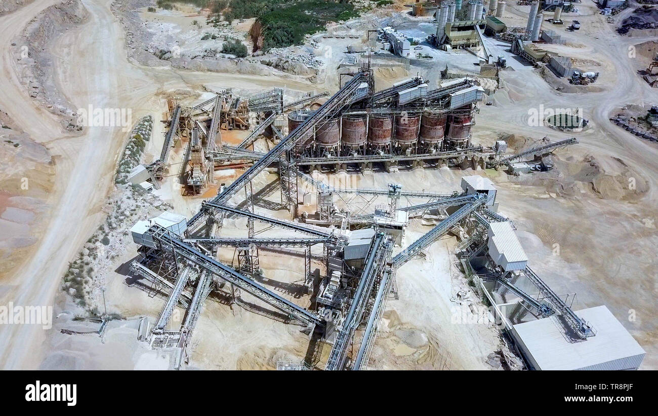 Large Quarry during work hours with Stone sorting conveyor belts ...