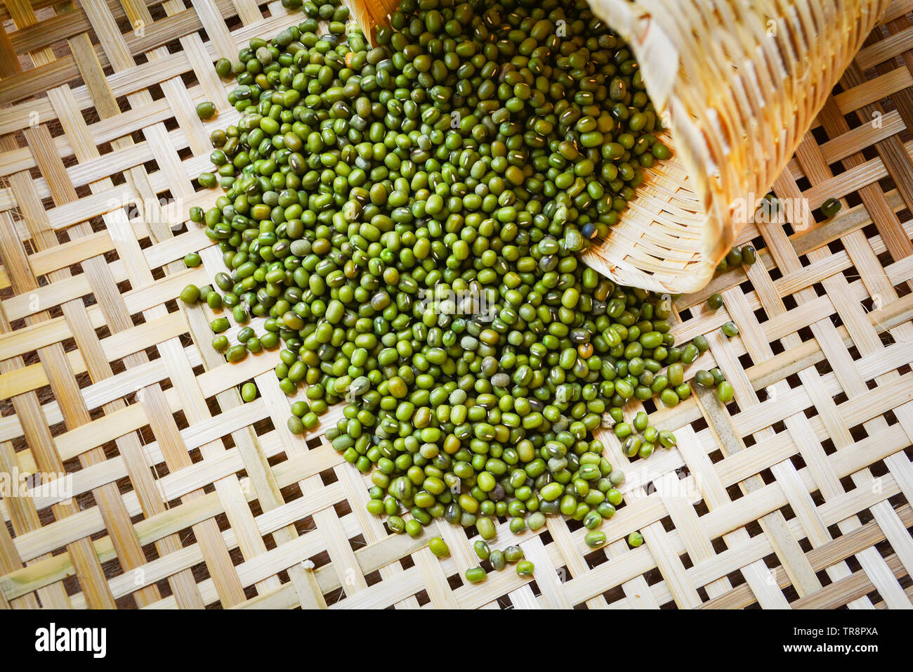 Mung beans or Green beans seed cereal whole grains on bamboo threshing ...