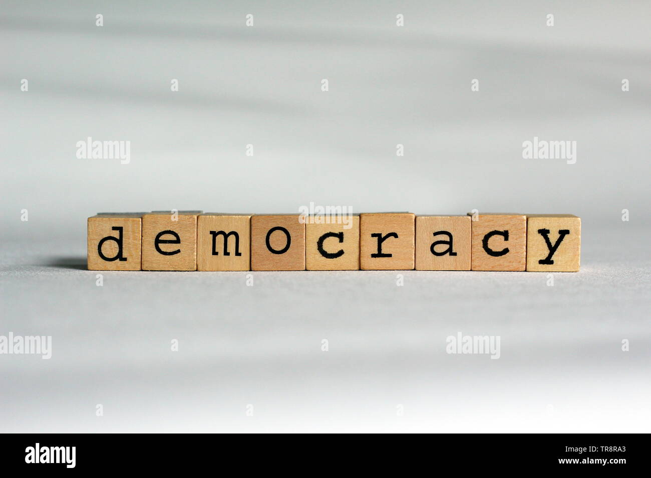 The word democracy made with wooden blocks, actually stamps Stock Photo ...