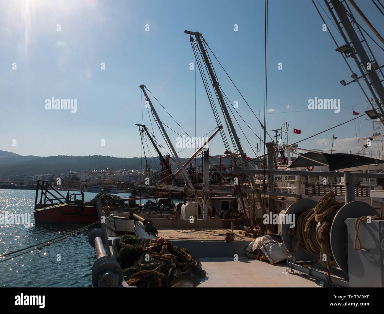 Old rusty fishermen boats with winch hoisting mechanisms in the harbor ...