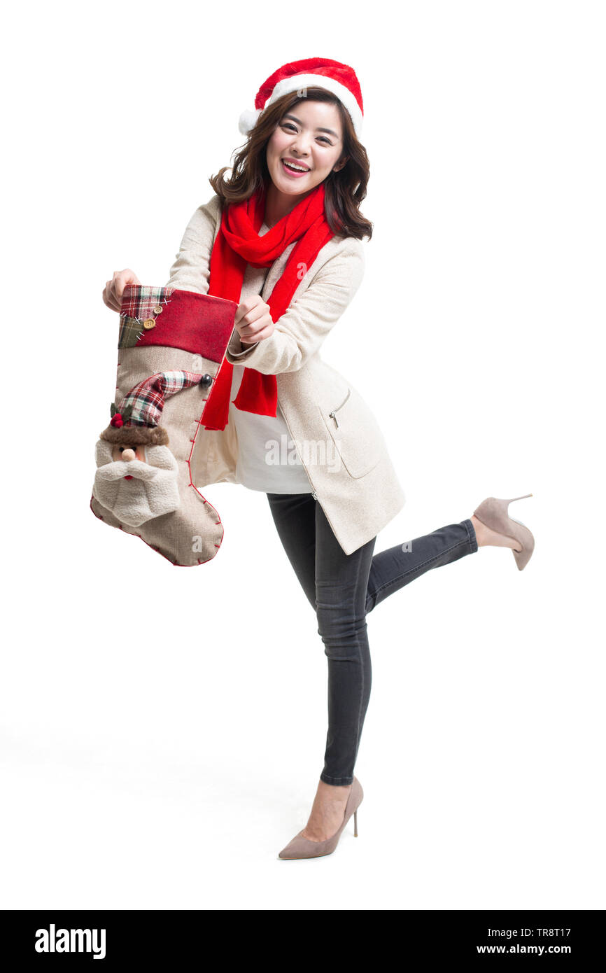 Happy woman celebrating christmas Cut Out Stock Images & Pictures - Alamy