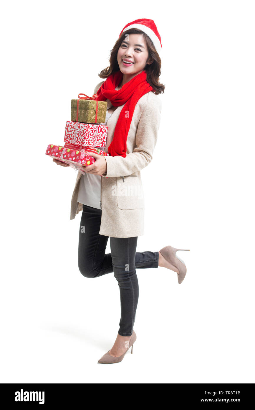 Happy woman celebrating christmas Cut Out Stock Images & Pictures - Alamy