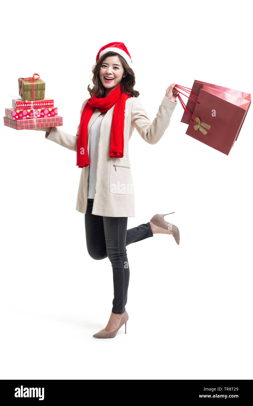 Happy woman celebrating christmas Cut Out Stock Images & Pictures - Alamy