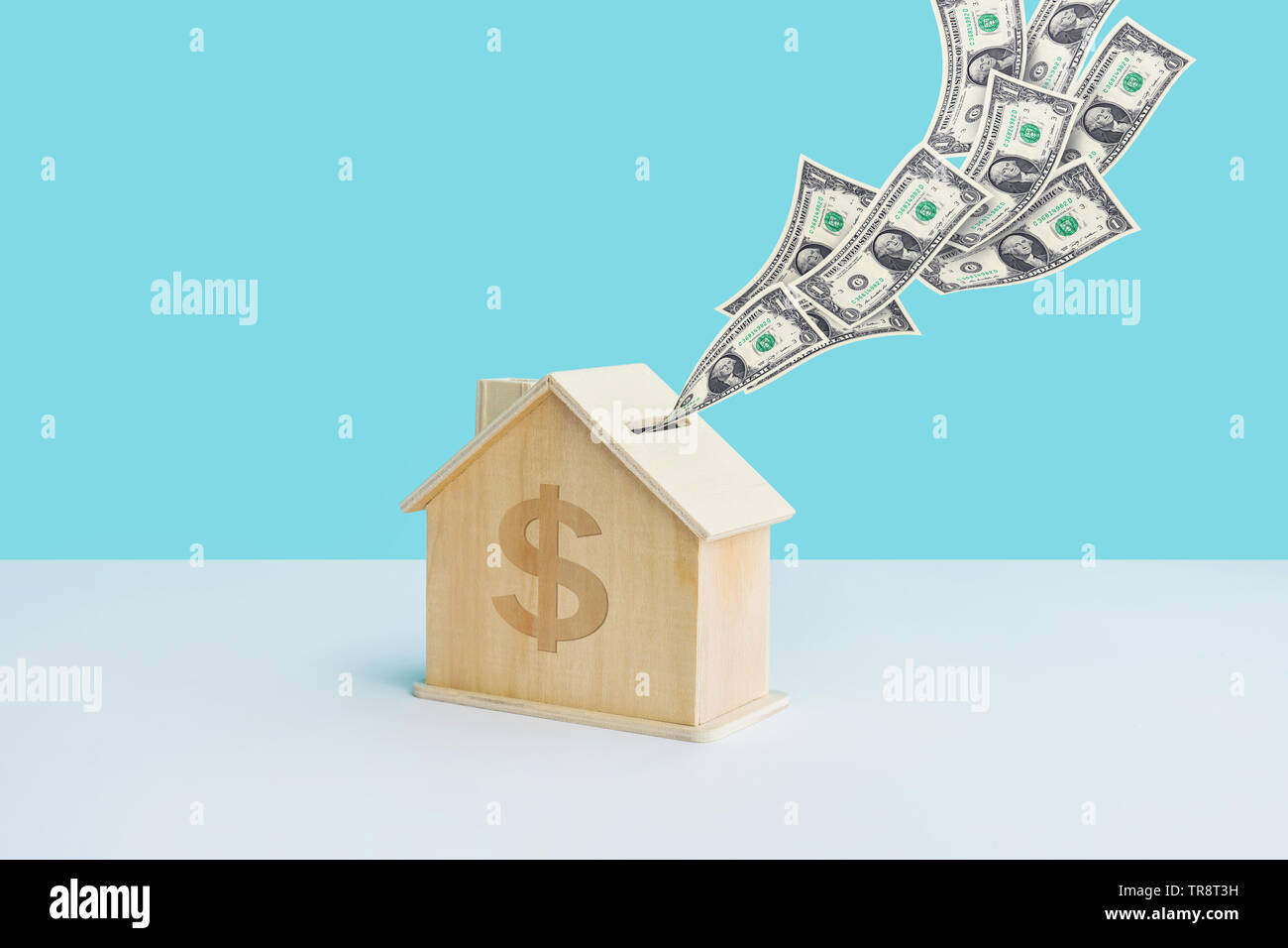 Saving money or financial concepts with home piggy bank and dollar bill ...