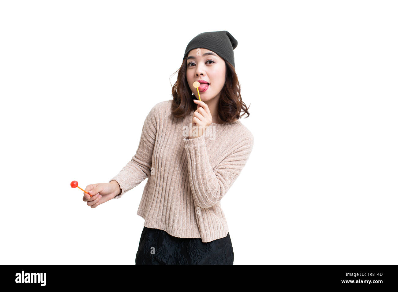 Woman licking lollipop candy hi-res stock photography and images - Alamy