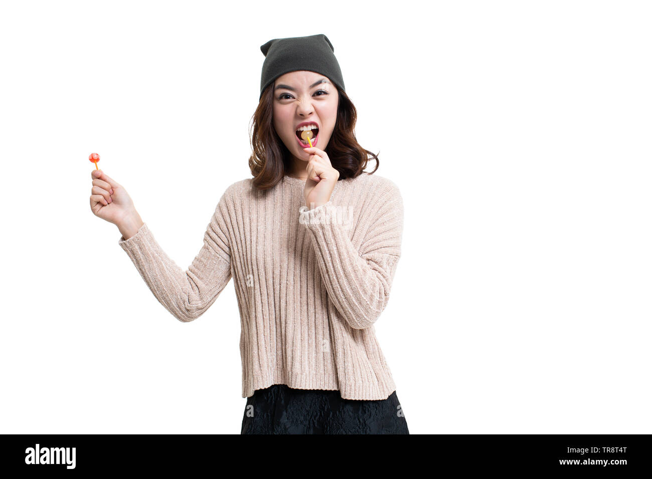 Young woman eating lollipop Stock Photo - Alamy