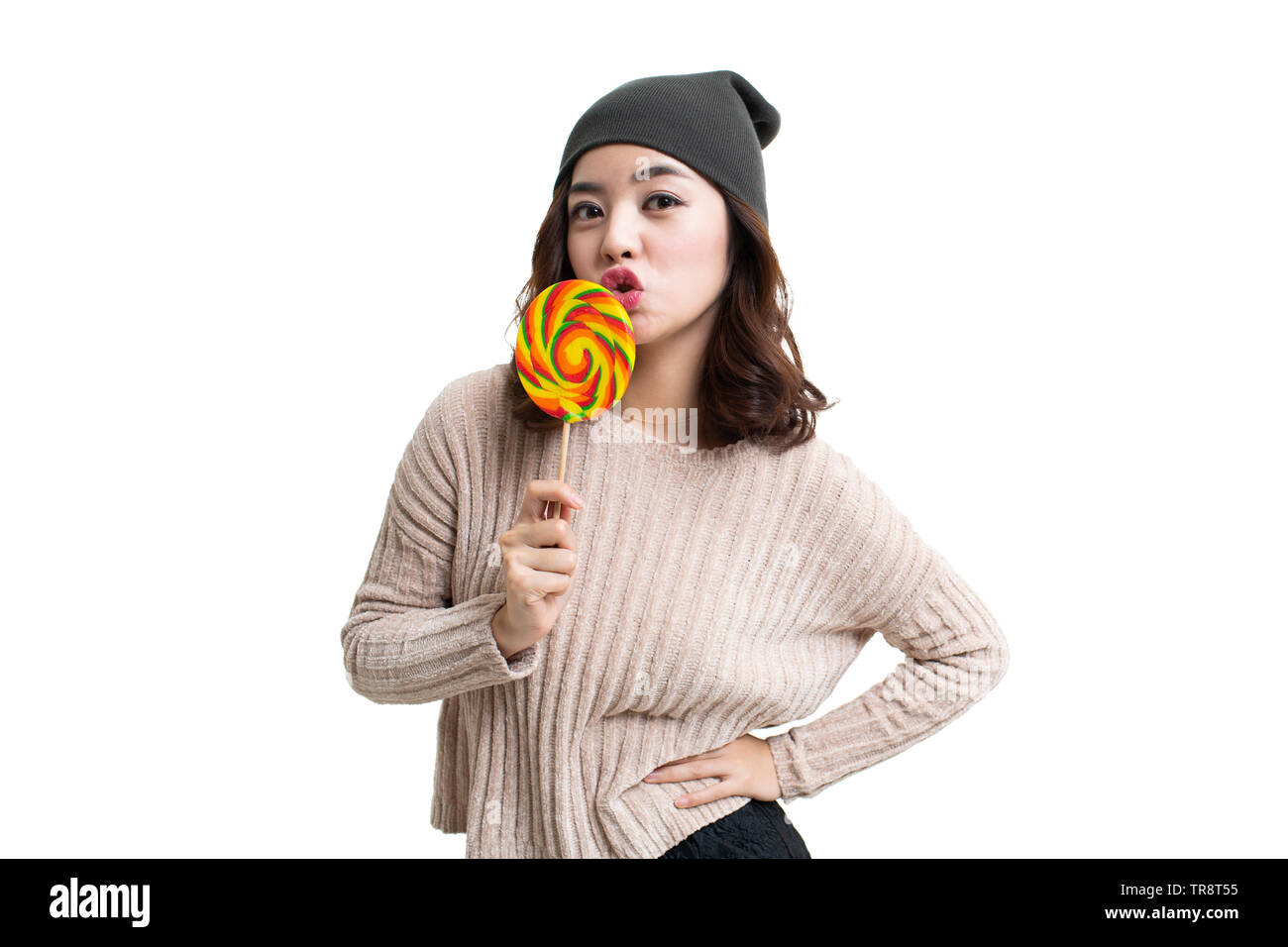Young woman eating lollipop Stock Photo - Alamy