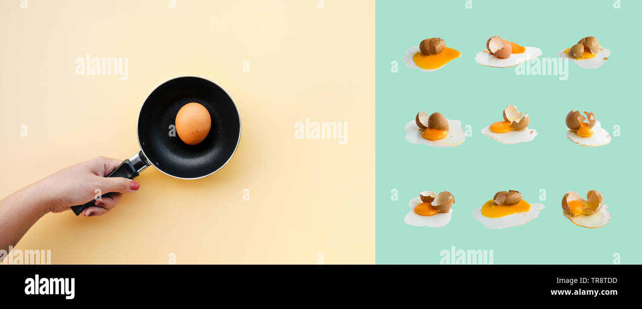 Cooking food concepts with female hand cooking egg on black pan and a ...