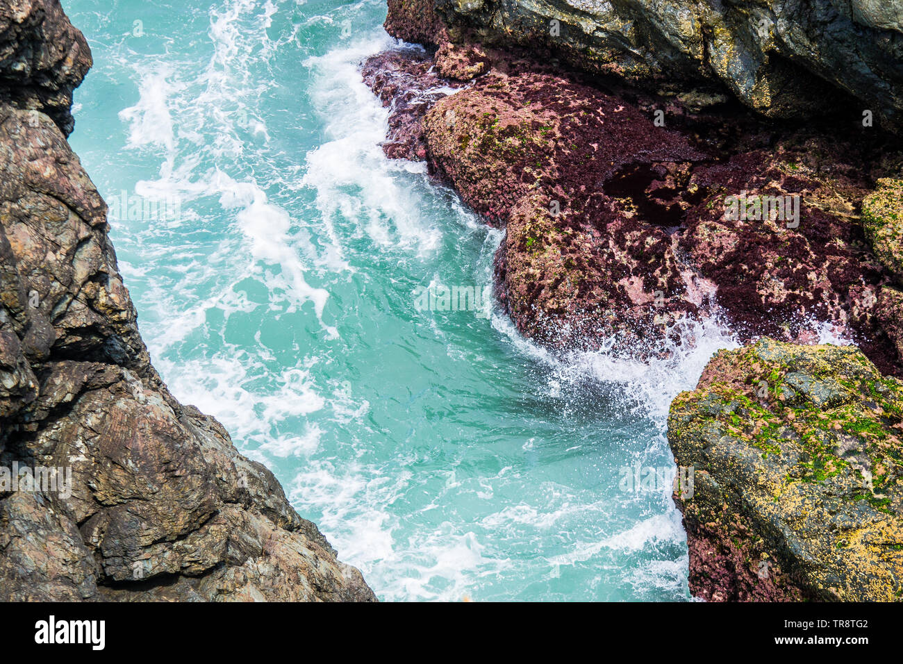 Rocks in the ocean Stock Photo - Alamy
