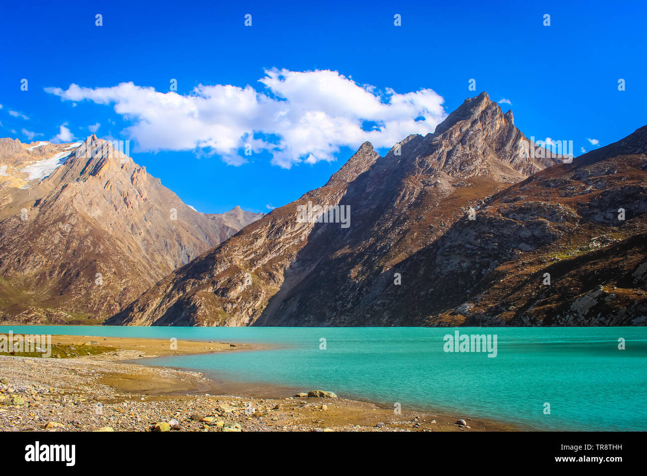 Deep green water of Sheshnag Lake with Amarnath Mountains in the ...