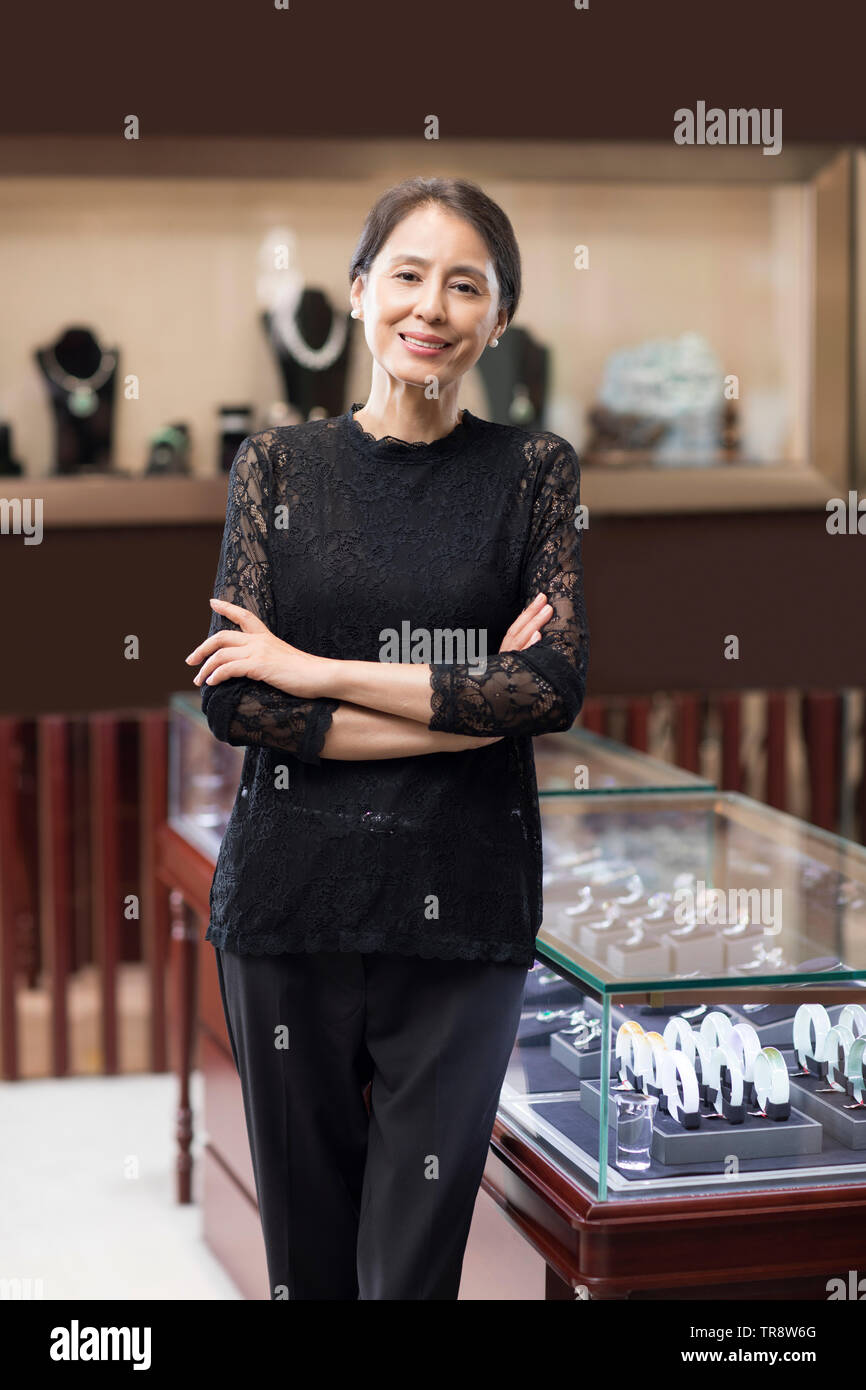 Cheerful shopkeeper hi-res stock photography and images - Alamy