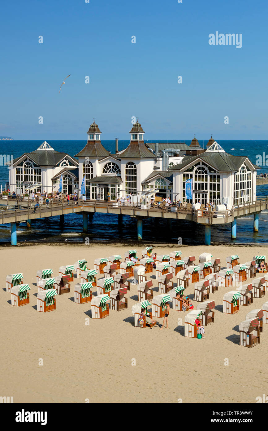 Deckchairs on the beach and the pier at Sellin Baltic Sea resort town ...