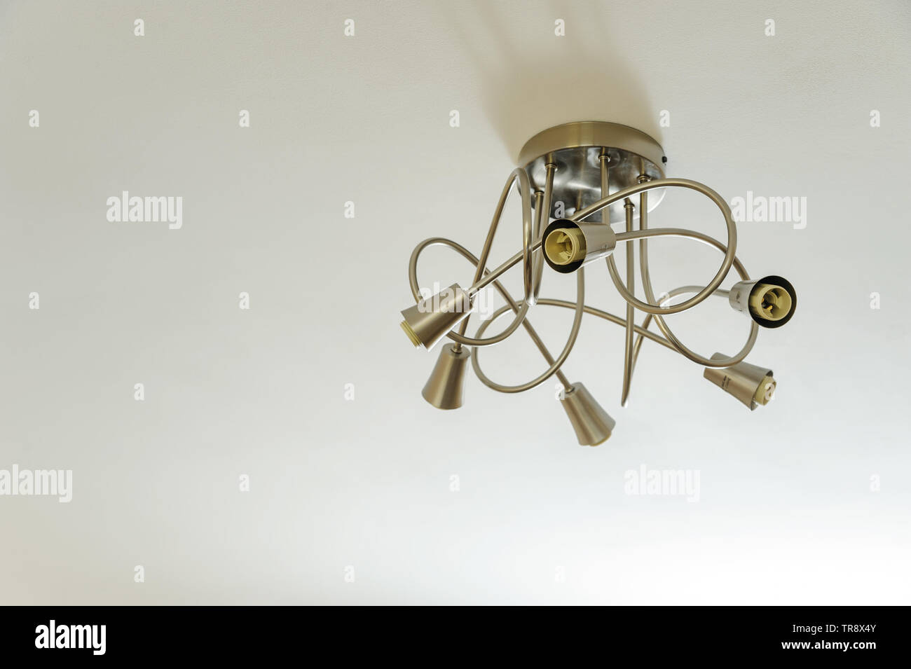 Modern lamp with no bulb is fixed to the ceiling Stock Photo - Alamy