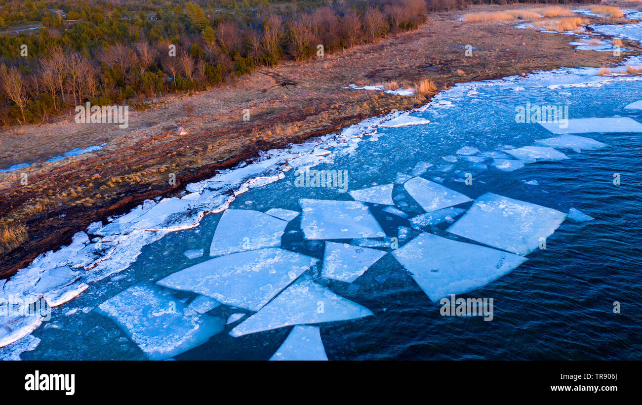 Massive slabs of ice in sea near shore Stock Photo - Alamy