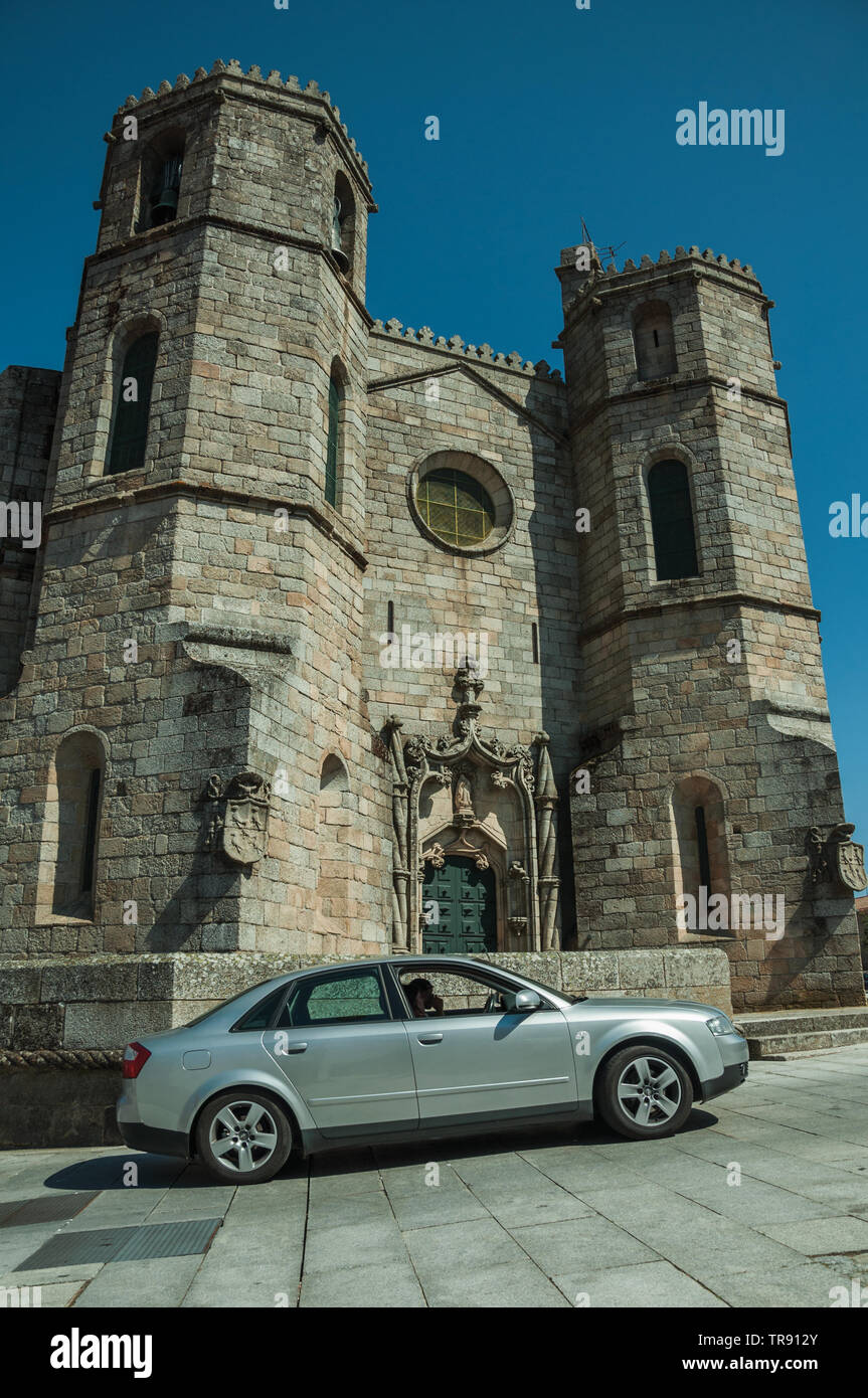 Car in front of gothic Cathedral with steeples, in a sunny day at ...
