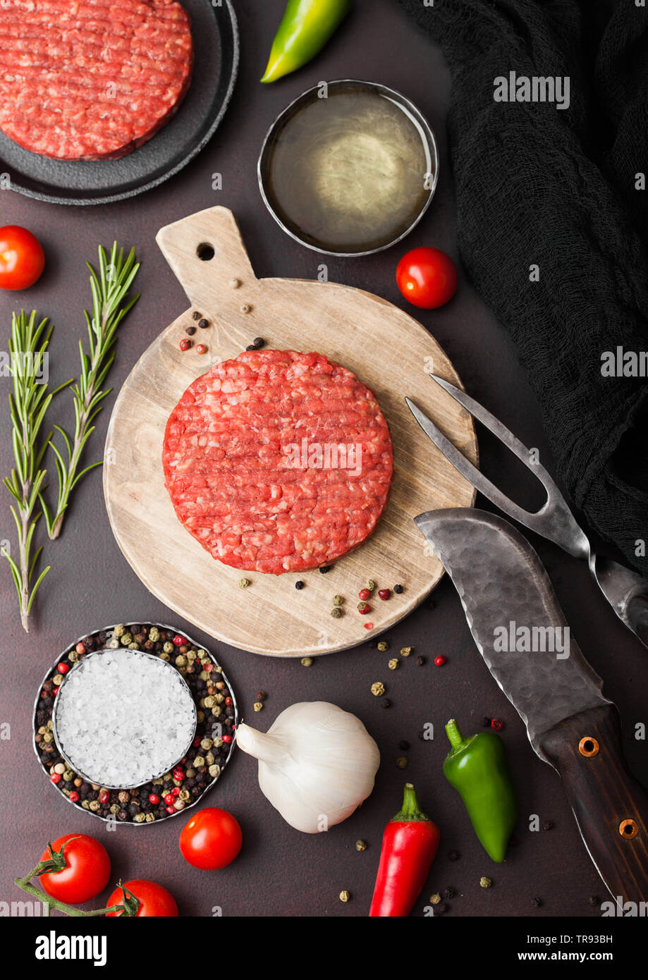 Fresh raw minced homemade farmers grill beef burger on round chopping ...