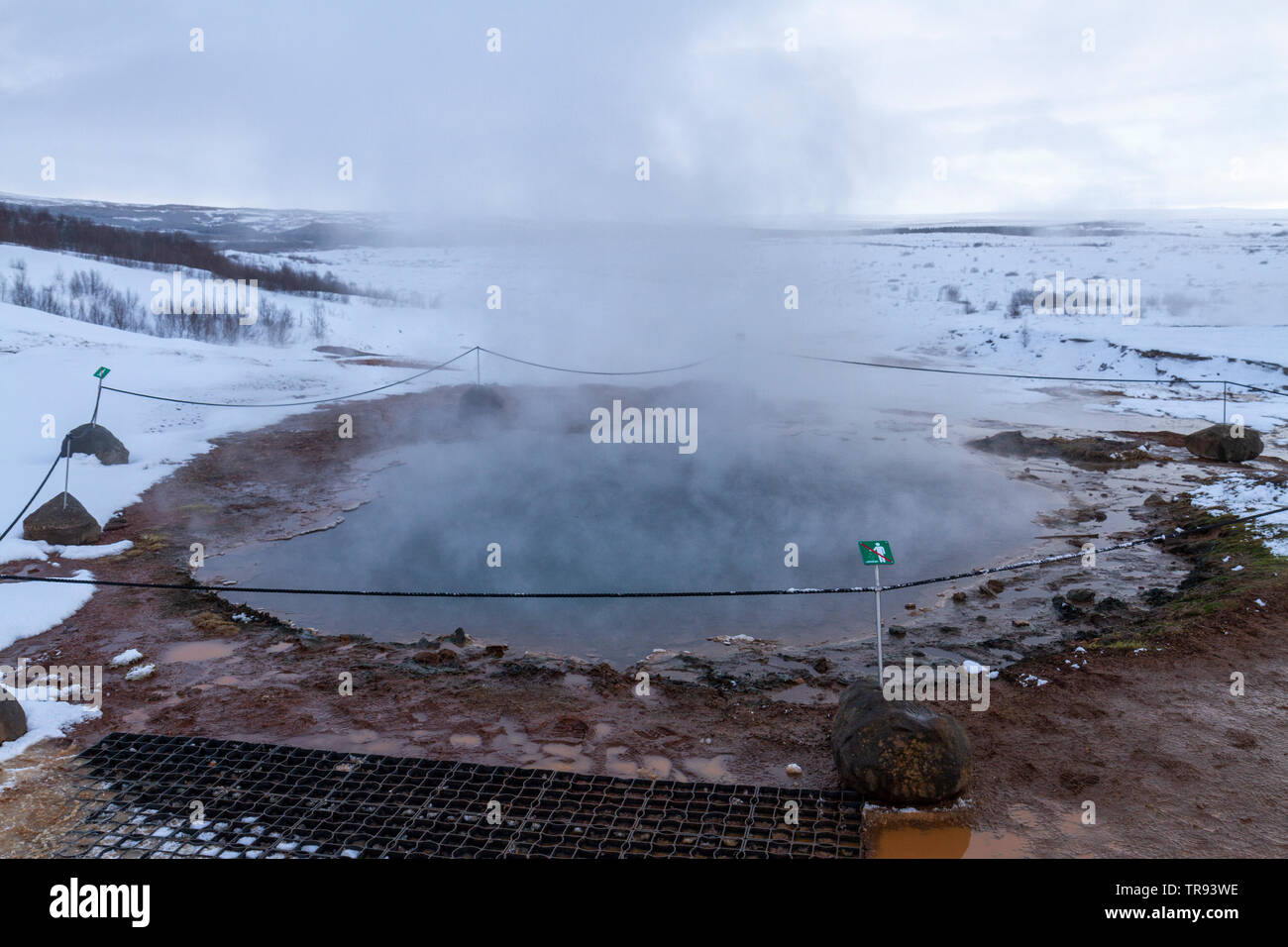 A bubbling thermal pool at the Geysir Hot Springs geothermal field ...
