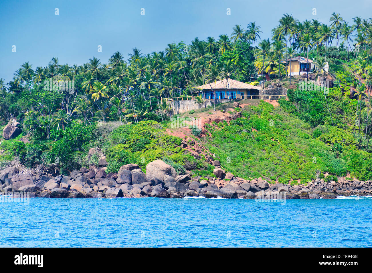 Beautiful day on tropical sea island. Side view, close up. House among ...