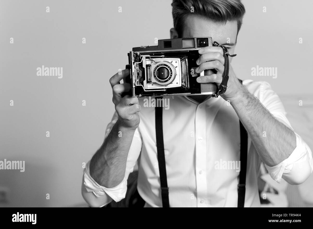 Men with Old Vintage Camera Stock Photo - Alamy