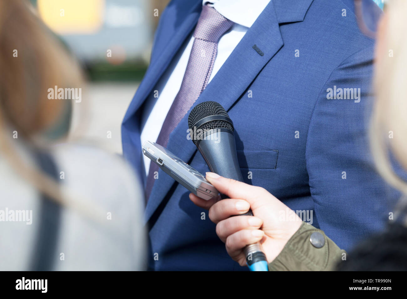 A businessman or a politician talking to the media. Press interview ...