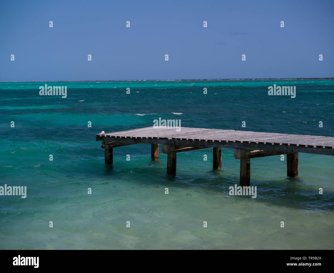Pier on the beach, Half Moon Caye, Lighthouse Reef Atoll, Belize Stock ...