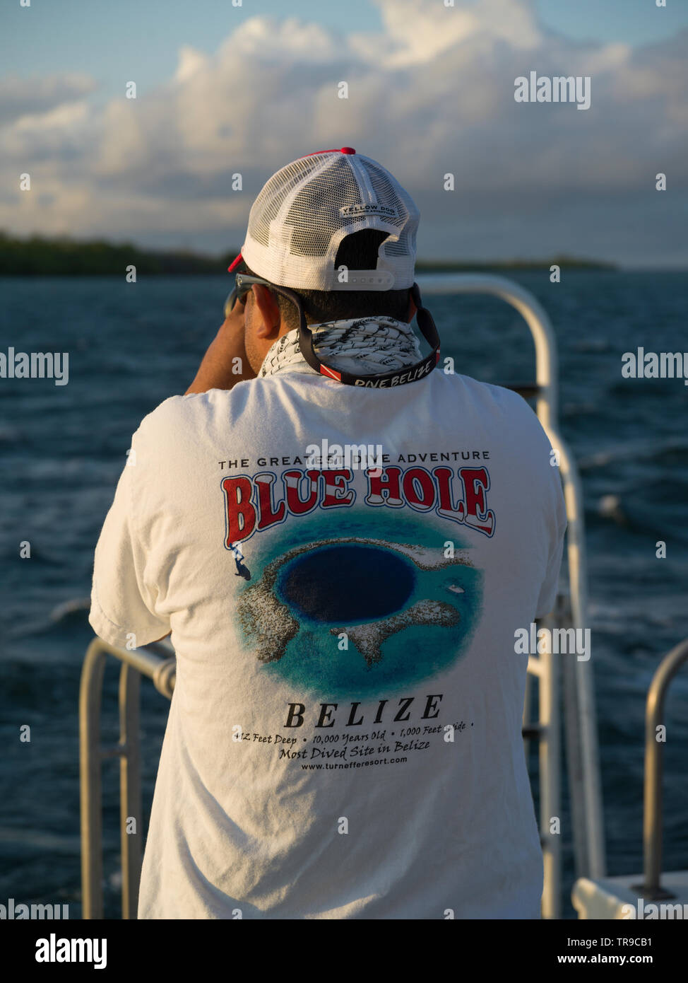 Man on boat, Belize Stock Photo - Alamy