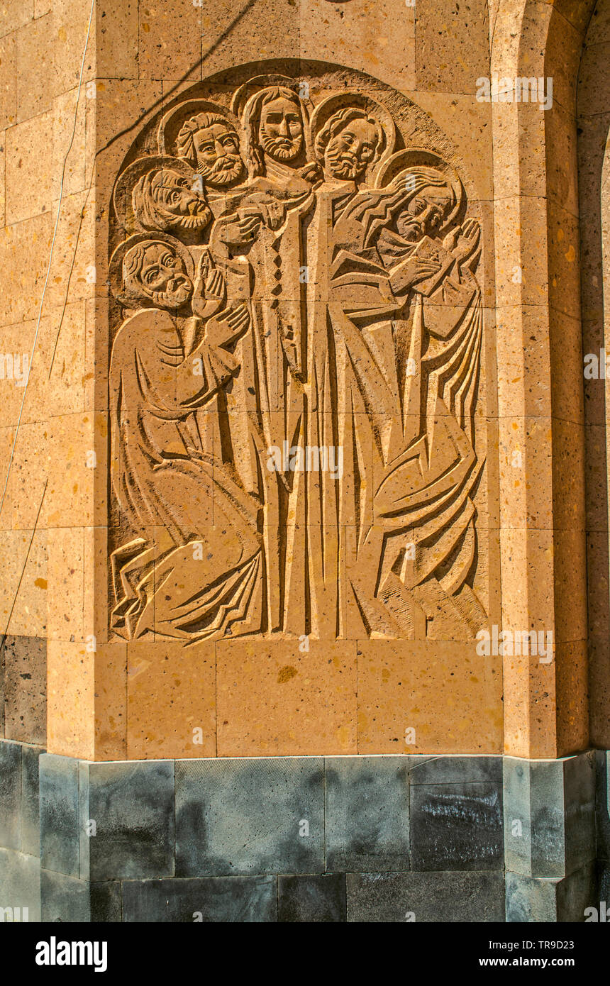 Carved on stone the Holy martyrs on the wall of the oval portal at the ...