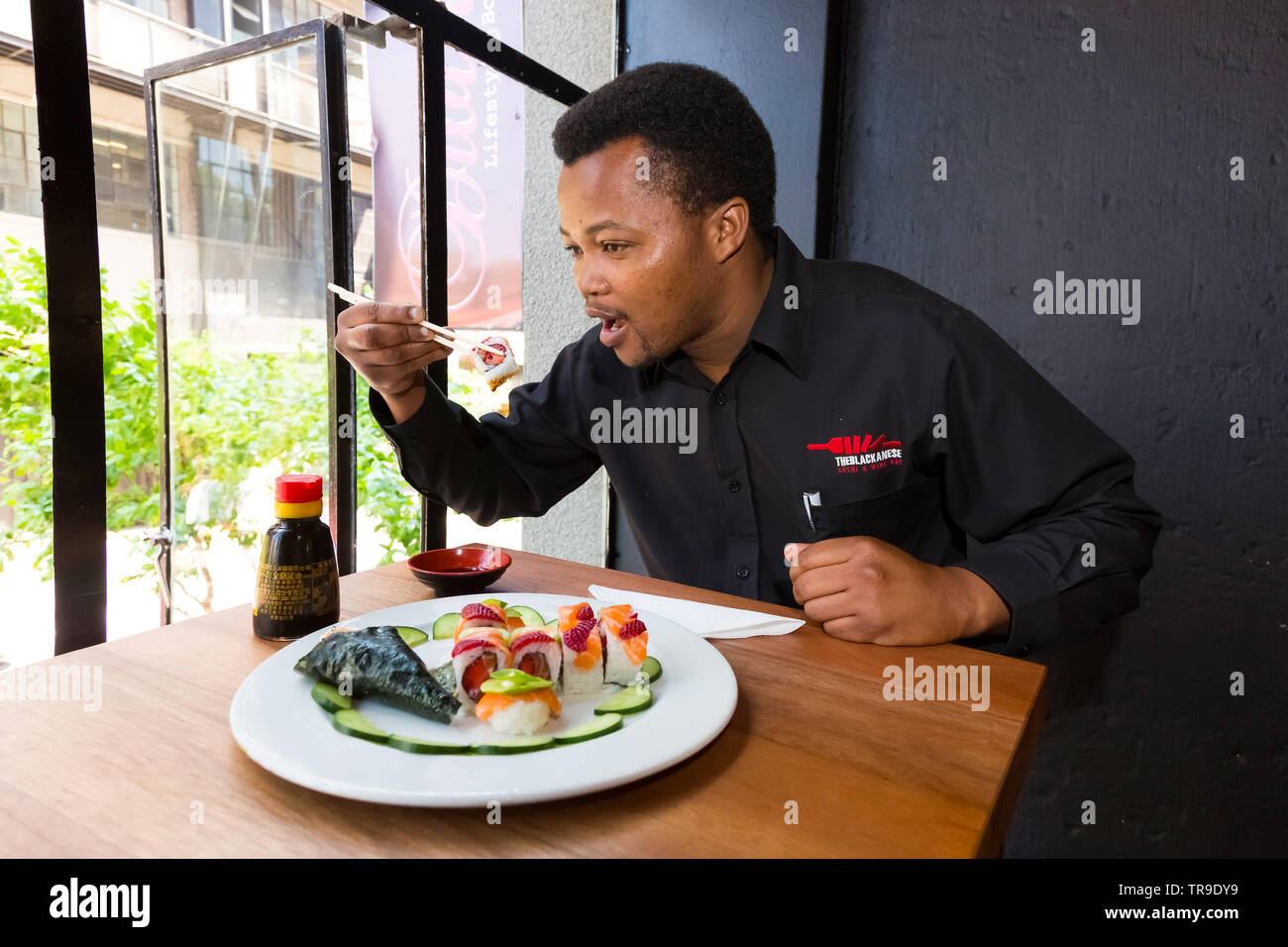 Johannesburg, South Africa - September 28 2014: African Man eating ...
