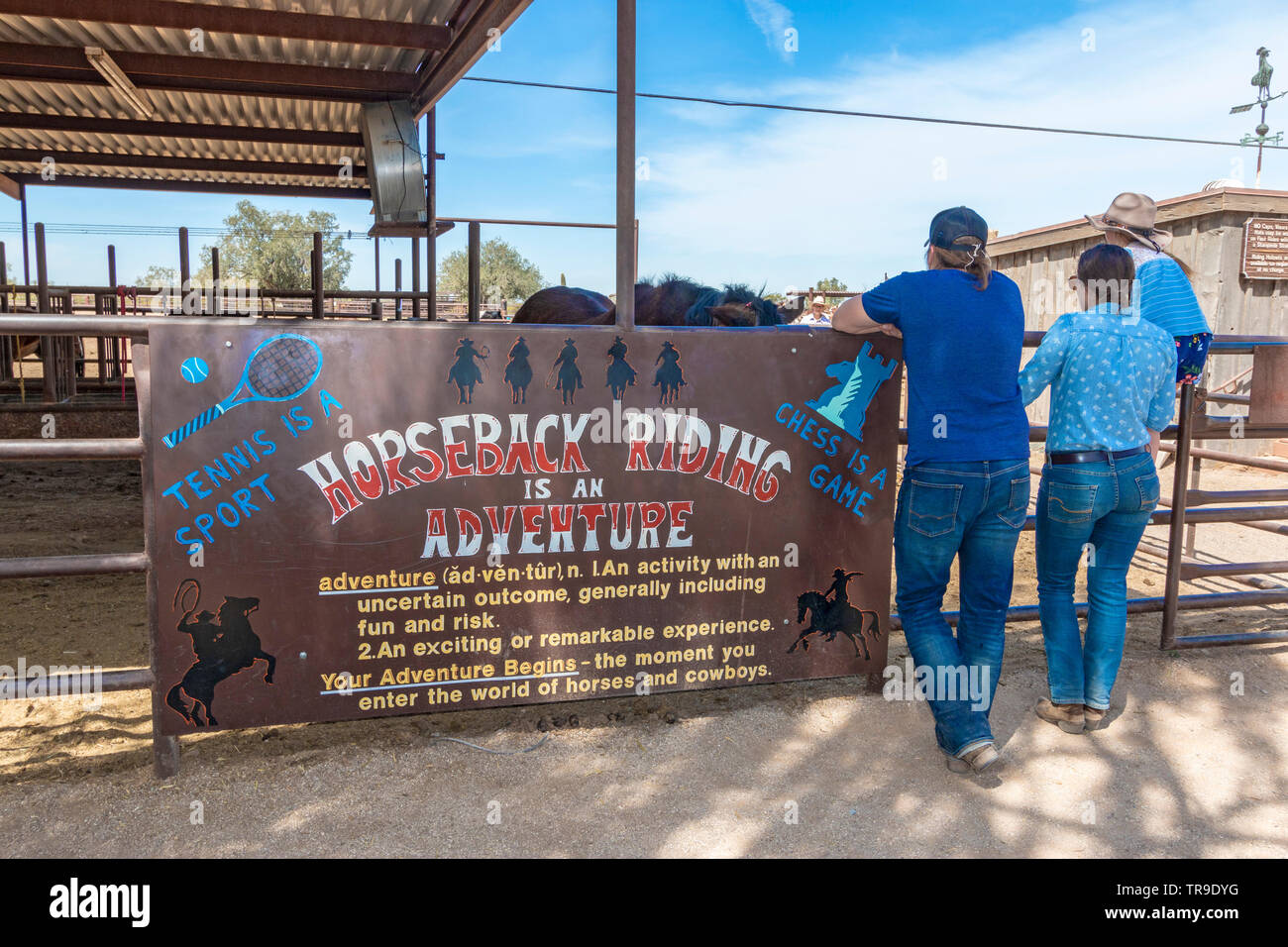 Signs near the horse corral at White Stallion Ranch, a dude ranch just ...