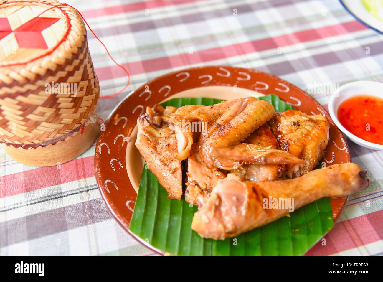 Gai Yang, or Thai-Style Grilled Chicken, with Sticky Rice Stock Photo ...