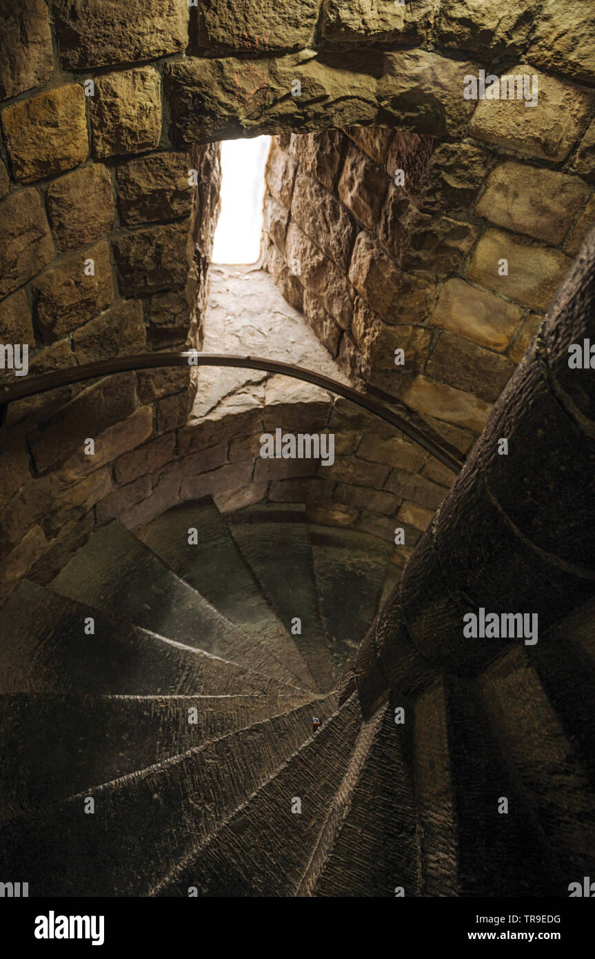 Stone stairs inside tower of the Gravensteen Castle at Ghent. City with ...