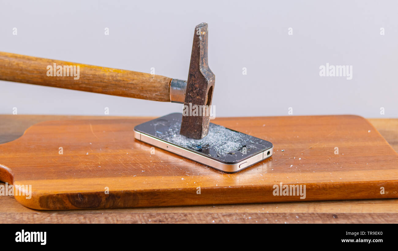 Old broken mobile phone hammer hi-res stock photography and images - Alamy