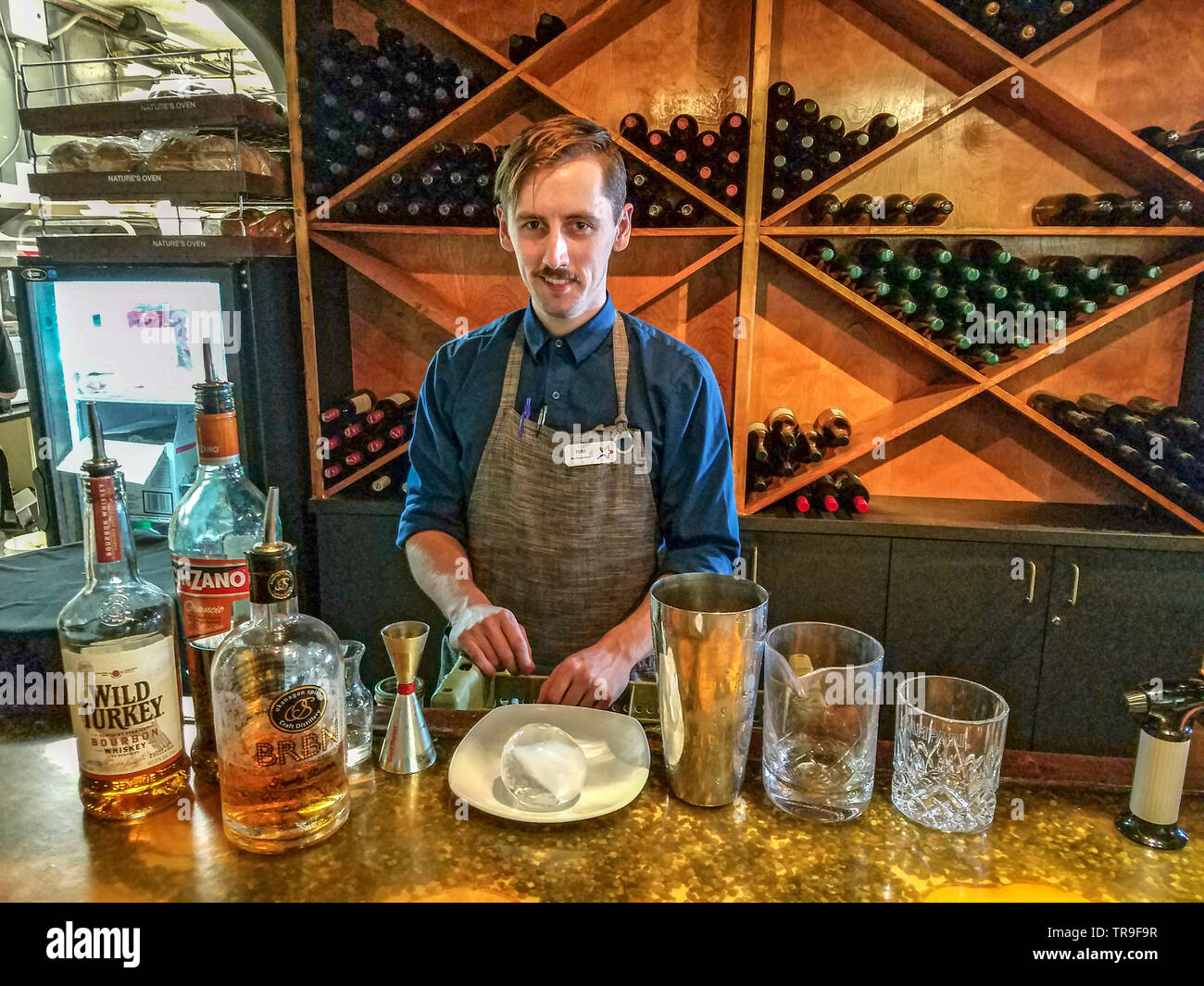 Bar Supervisor Tom Falland creating his signature Smoked Old Fashioned ...