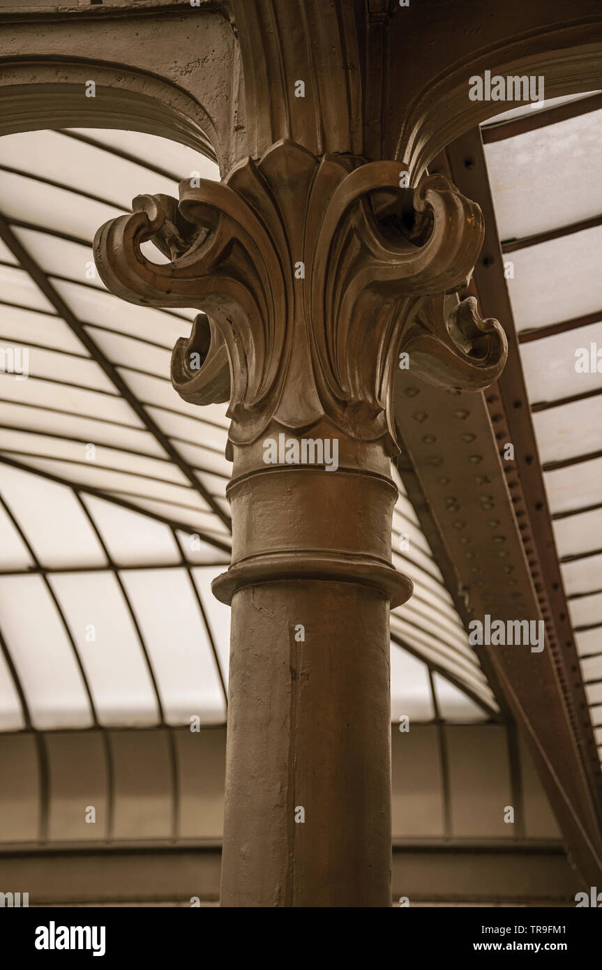 Detail of cast-iron capital in Art Nouveau style and glass ceiling in ...