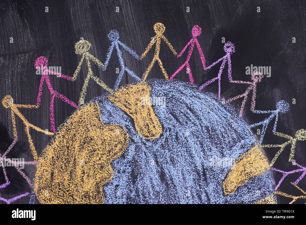 Group of people around the world. Chalk drawing. Blackboard. Close up ...