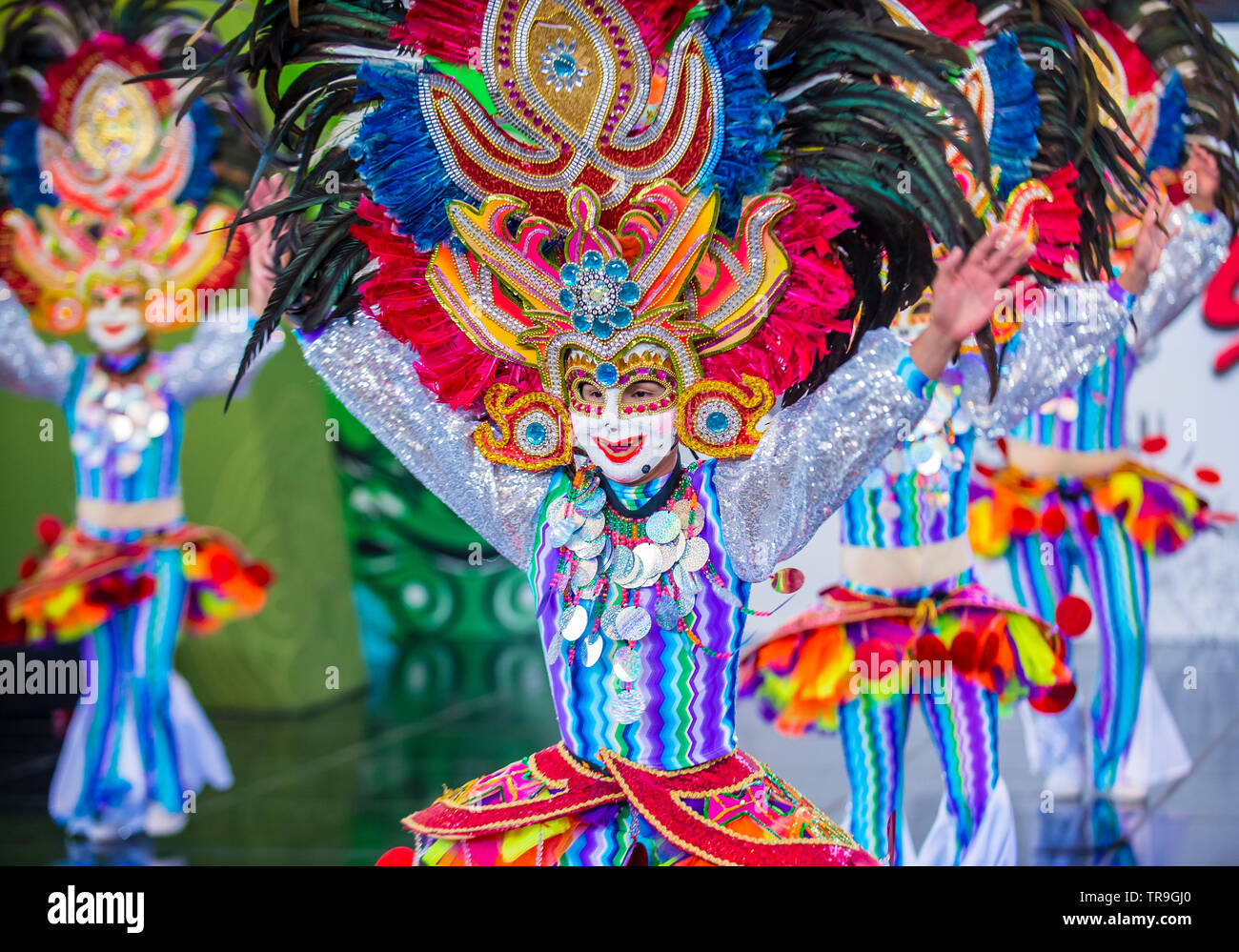 Filipino dancers from the Masskara festival of Bacolod perform at the ...