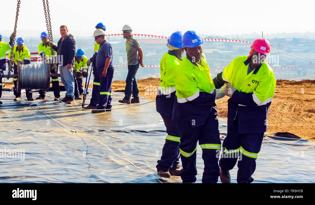 Johannesburg, South Africa - June 07 2010: Construction worker on a ...