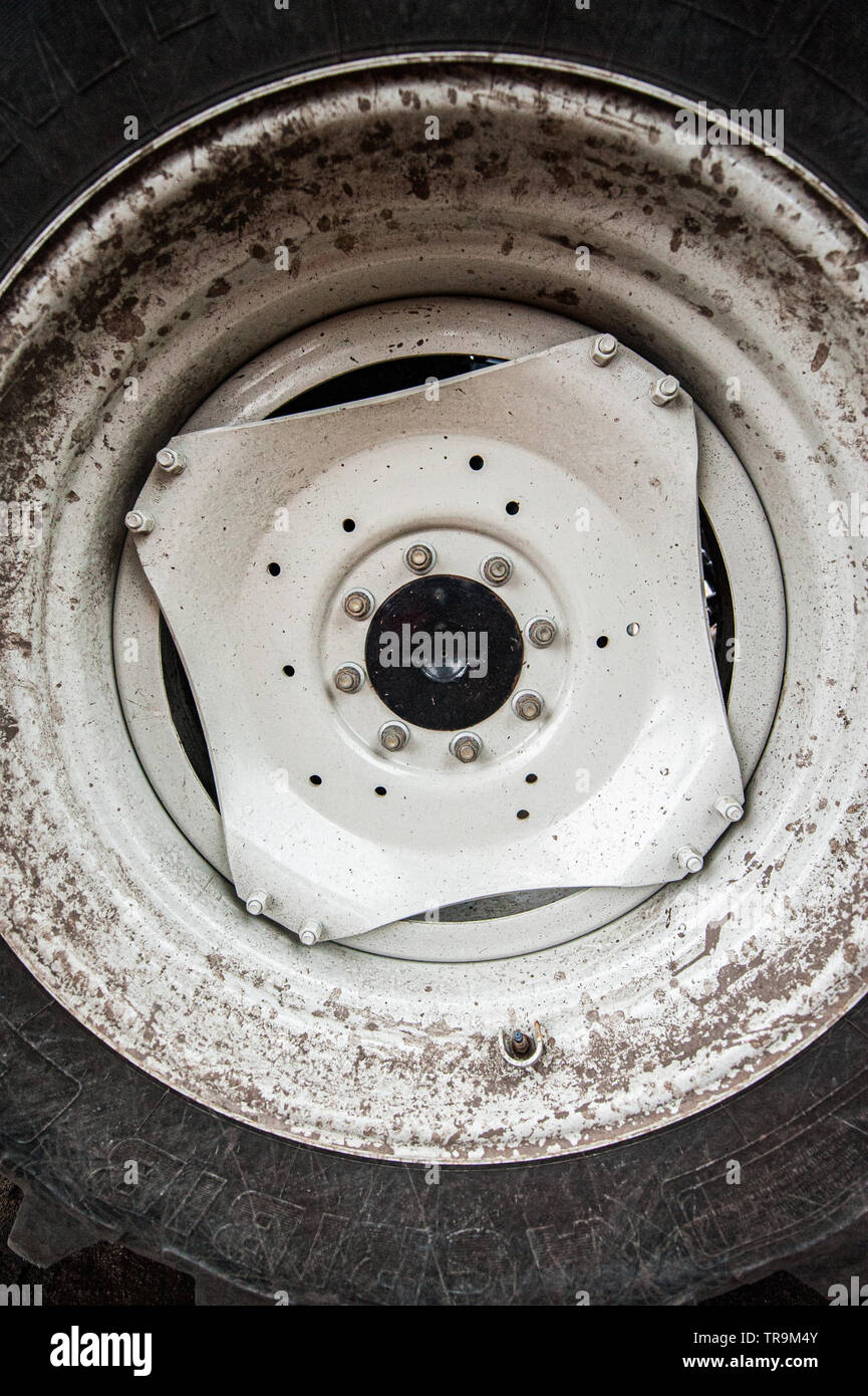 A white tractor wheel Stock Photo - Alamy