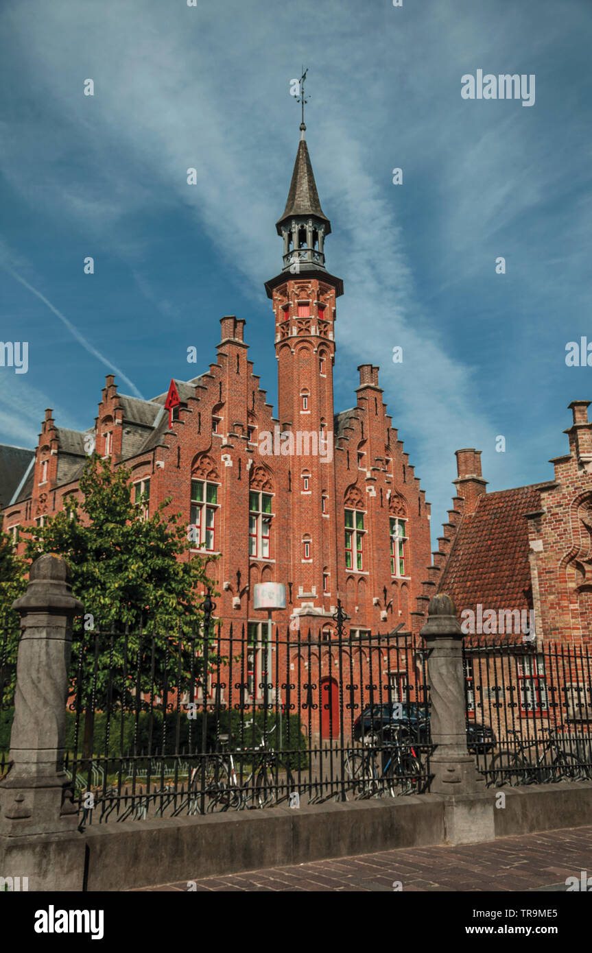 Iron fence and brick building in typical architecture of the Flanders ...