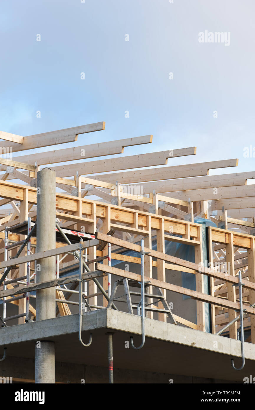 New house construction with balconies and roof trusses Stock Photo - Alamy
