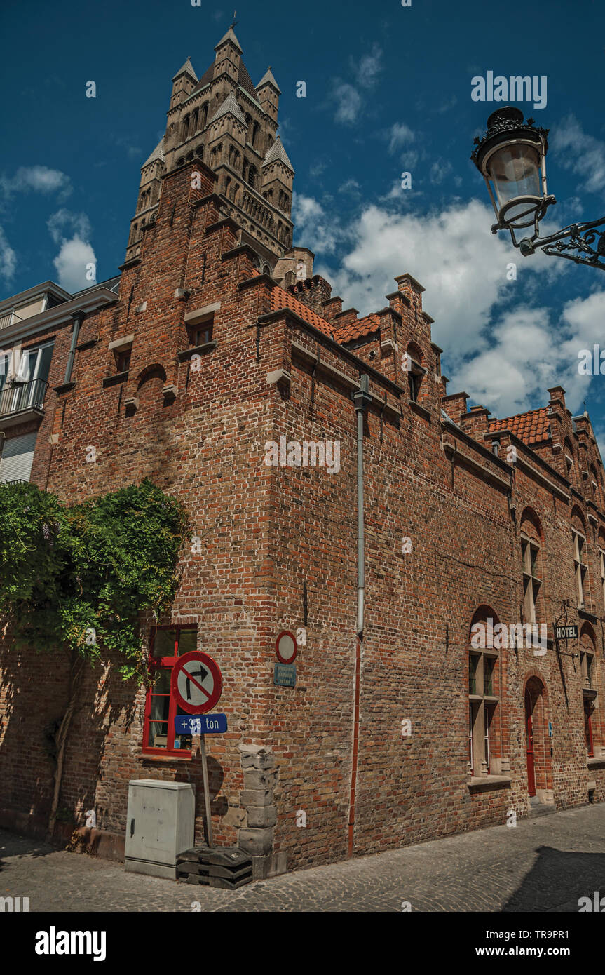Brick facade of house in typical style of the Flanders region in street ...