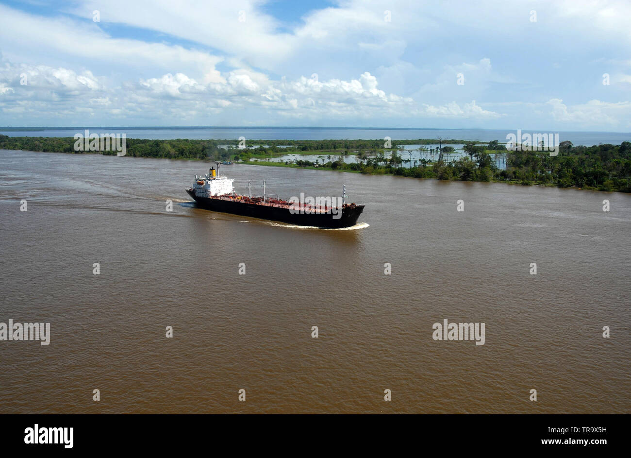 Aerial photo of the oil tanker sailing on the Amazon River, in the ...