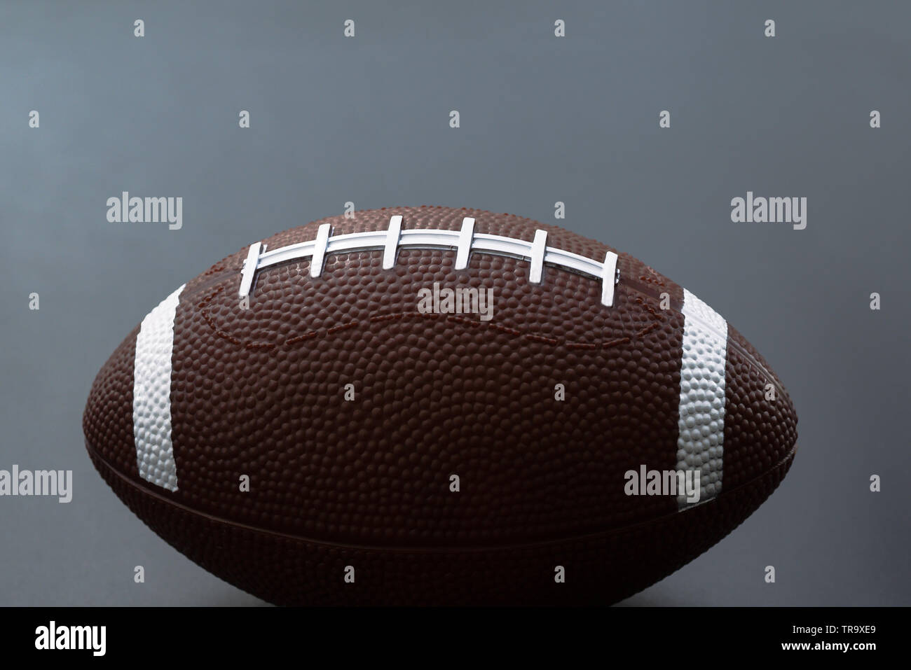 American football isolated on black background . Sport object concept ...