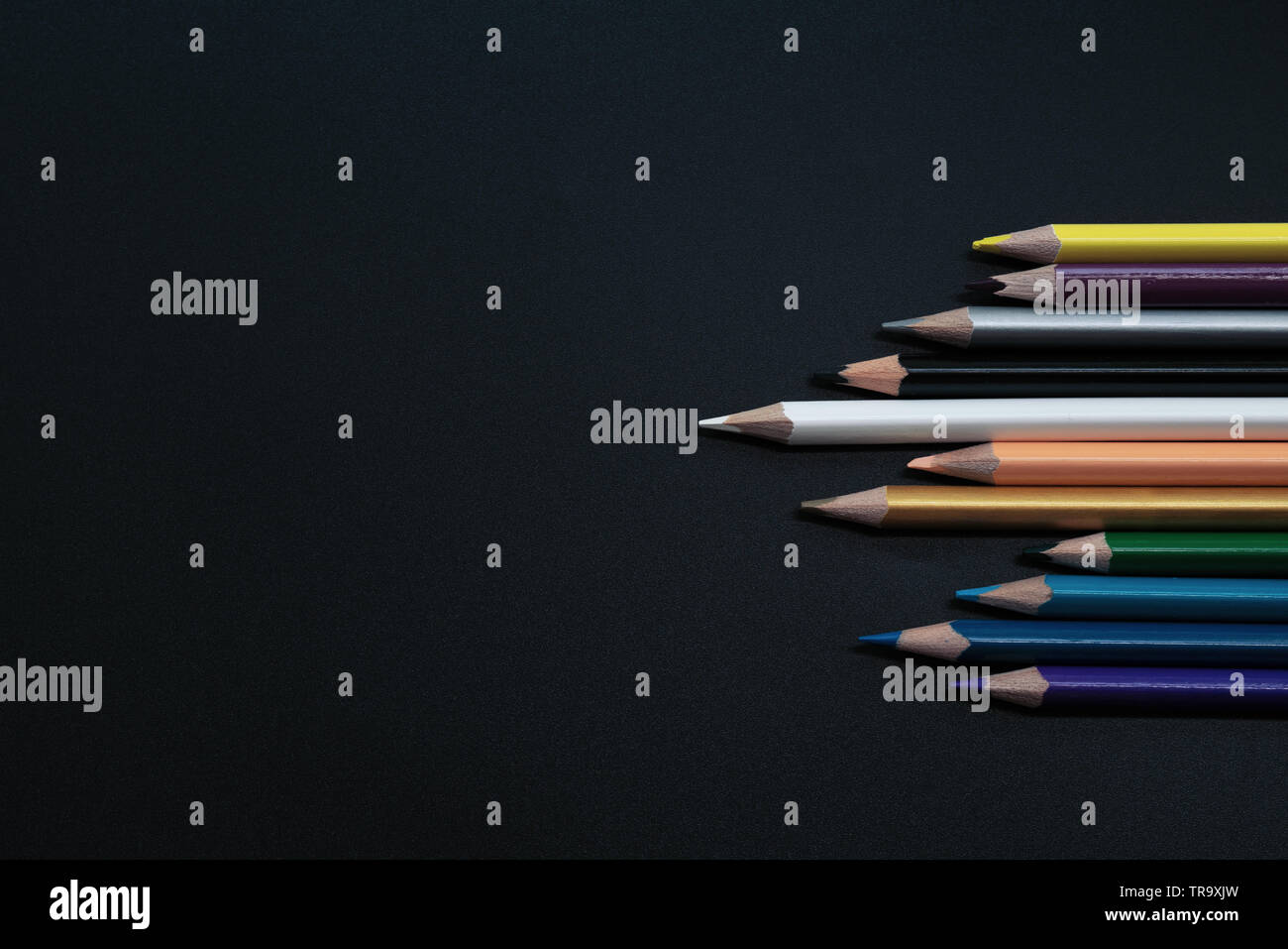Teamwork concept. group of color pencil on black background Stock Photo ...