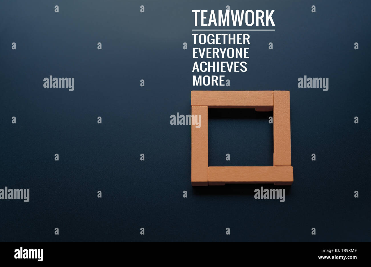 Teamwork concept. group of wooden square on the black backgrounds with ...