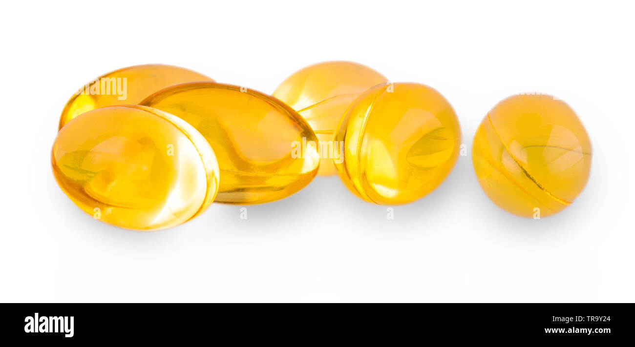 Yellow color soft gelatin capsule on white background (Concept of ...