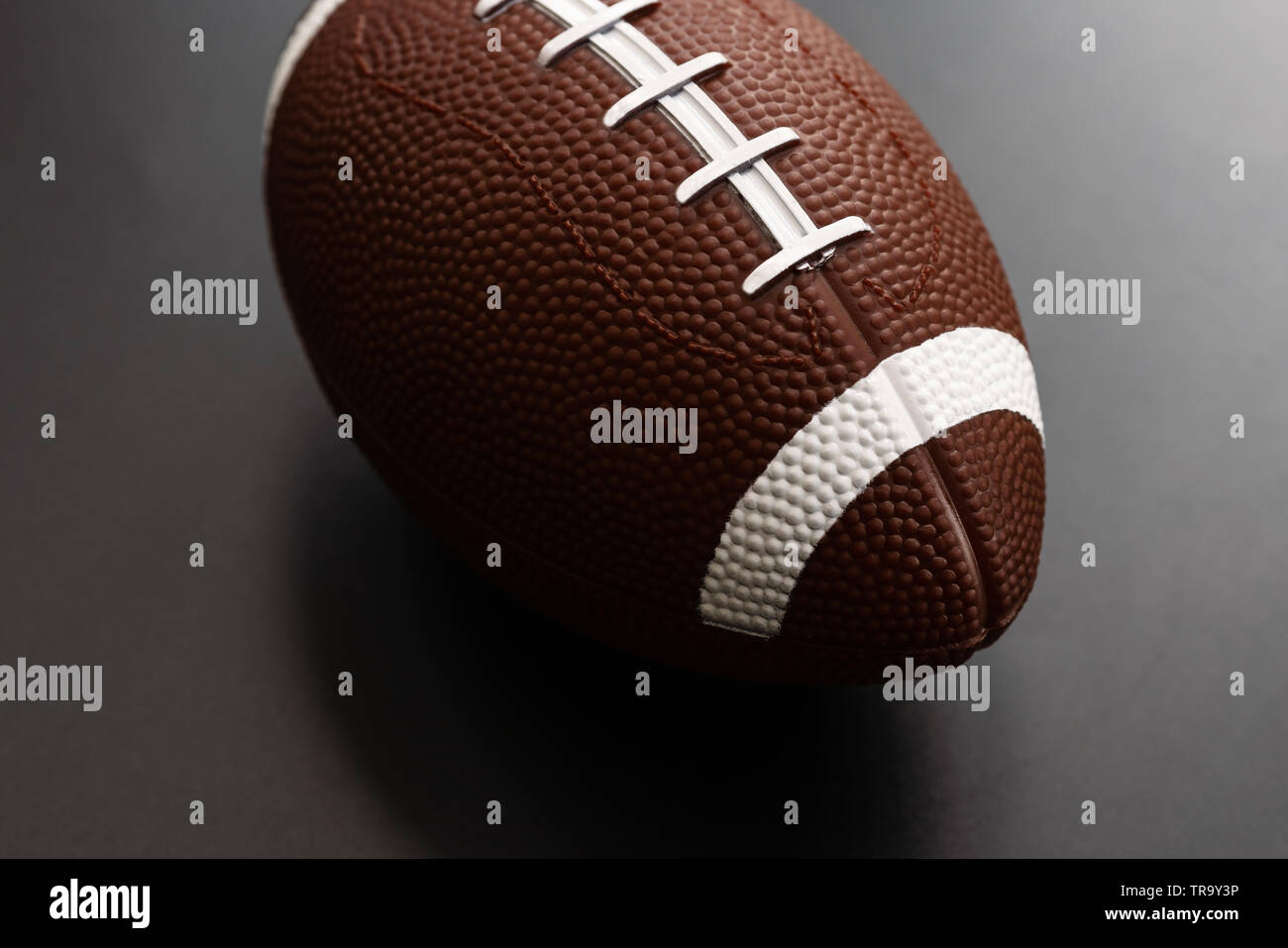 American football isolated on black background . Sport object concept ...